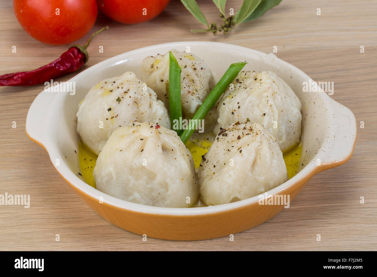 Georgian dumplings - Khinkali with minced meat and herbs Stock Photo ...