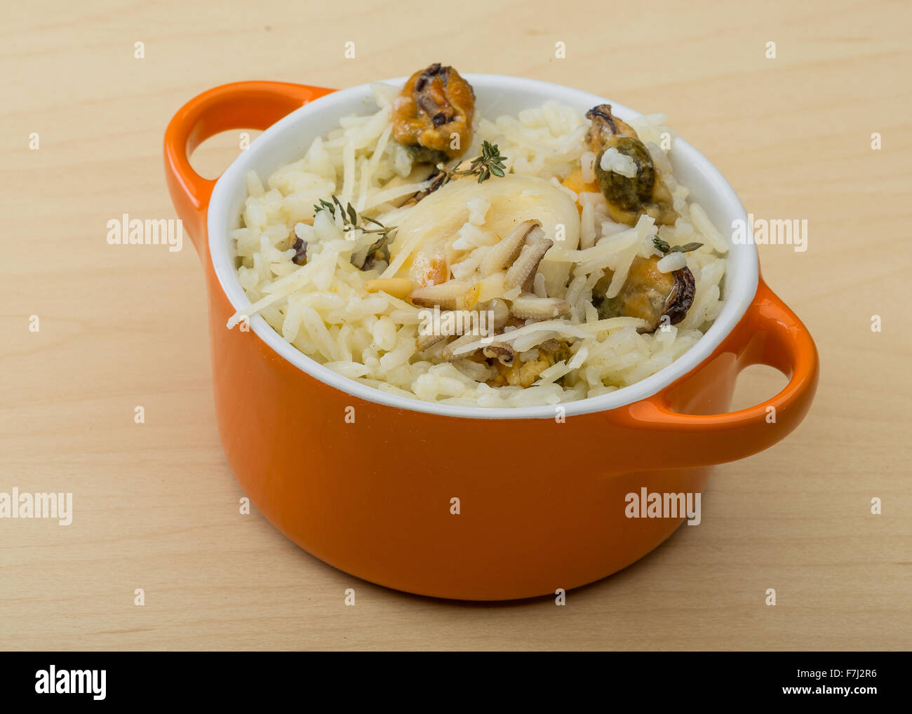 Risotto with mussels and cuttlefish served fresh thyme Stock Photo - Alamy