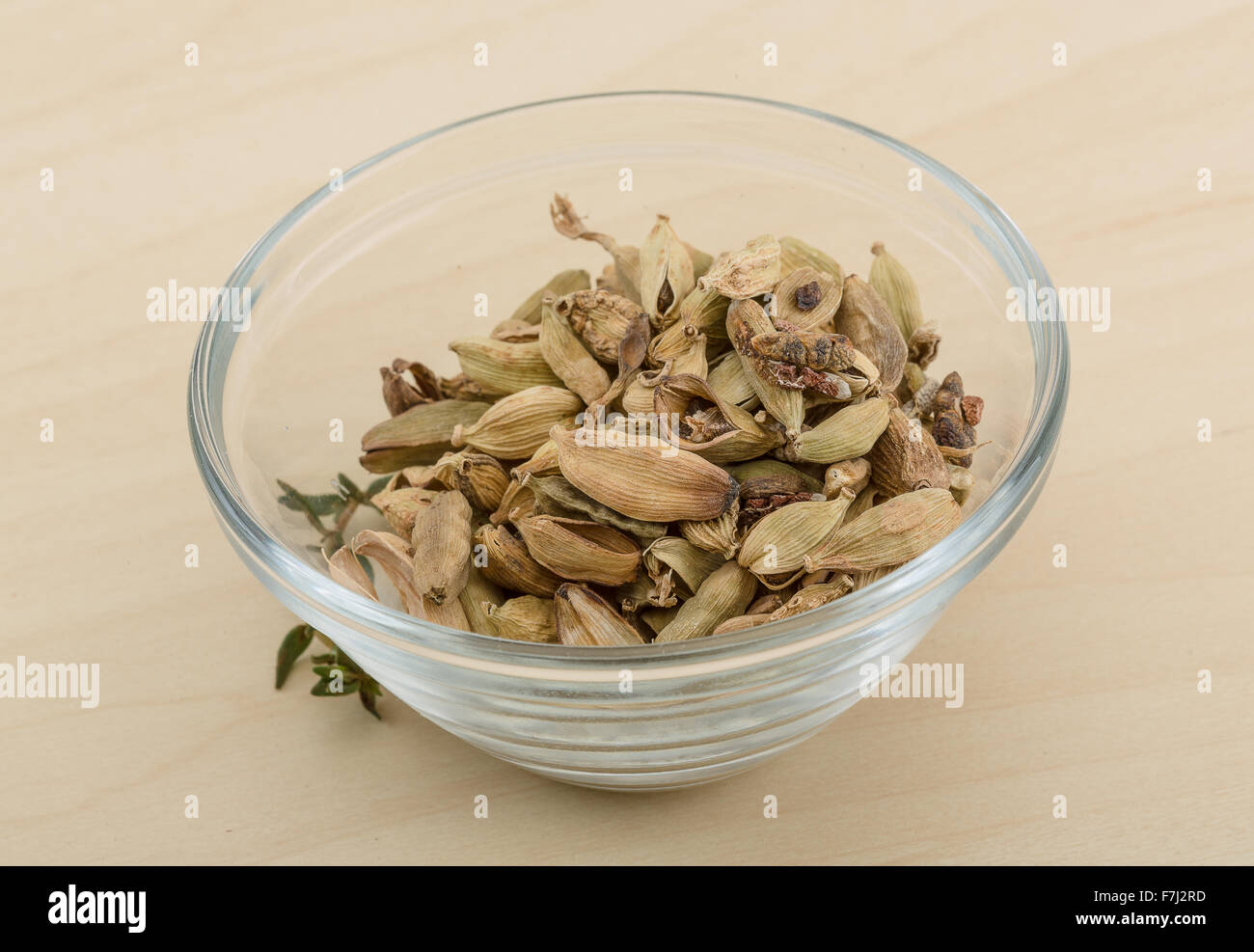 Dry Cardamom heap on the wood background Stock Photo - Alamy