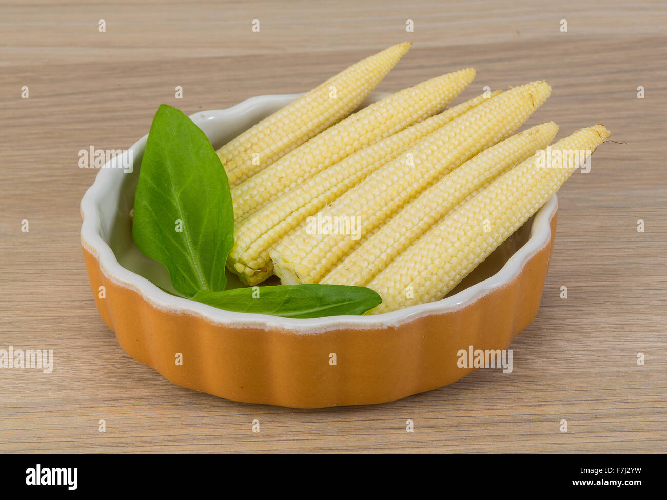 Fresh ripe Baby corn on the wood background Stock Photo - Alamy