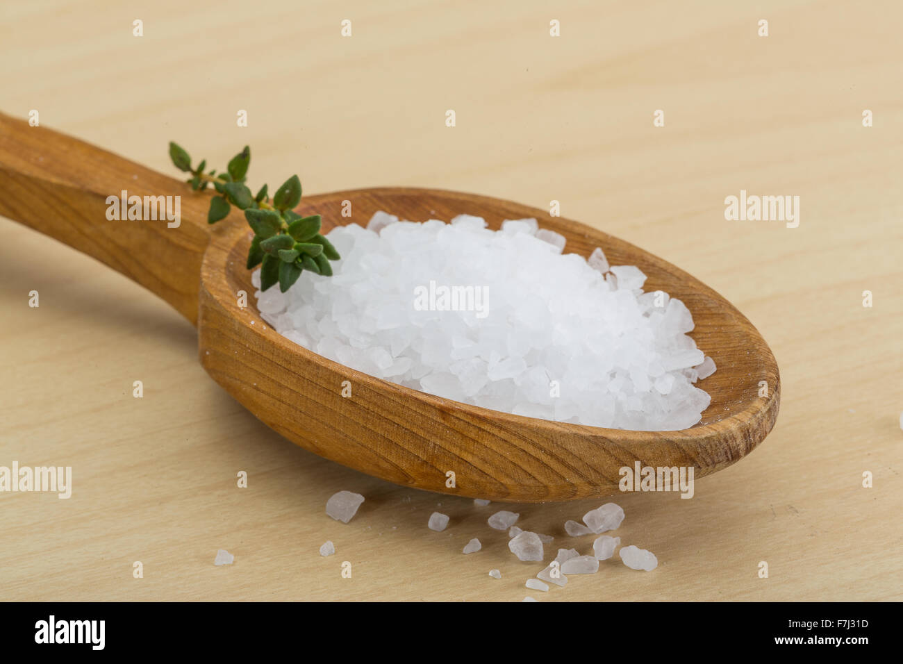 Sea salt heap crystal with thyme branch Stock Photo - Alamy