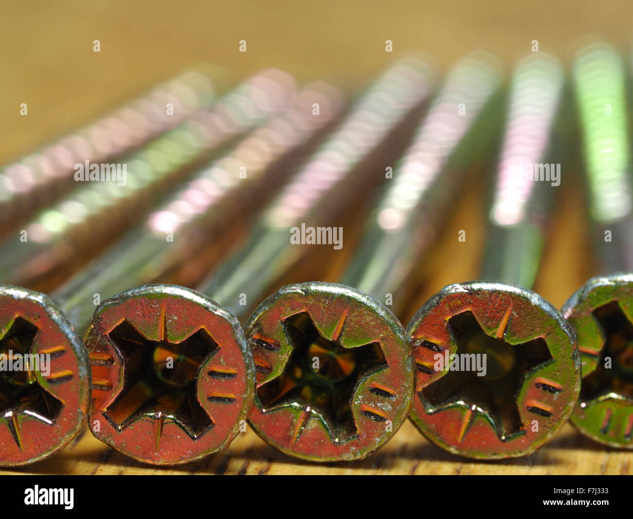 Colourful screw heads closeup Stock Photo - Alamy