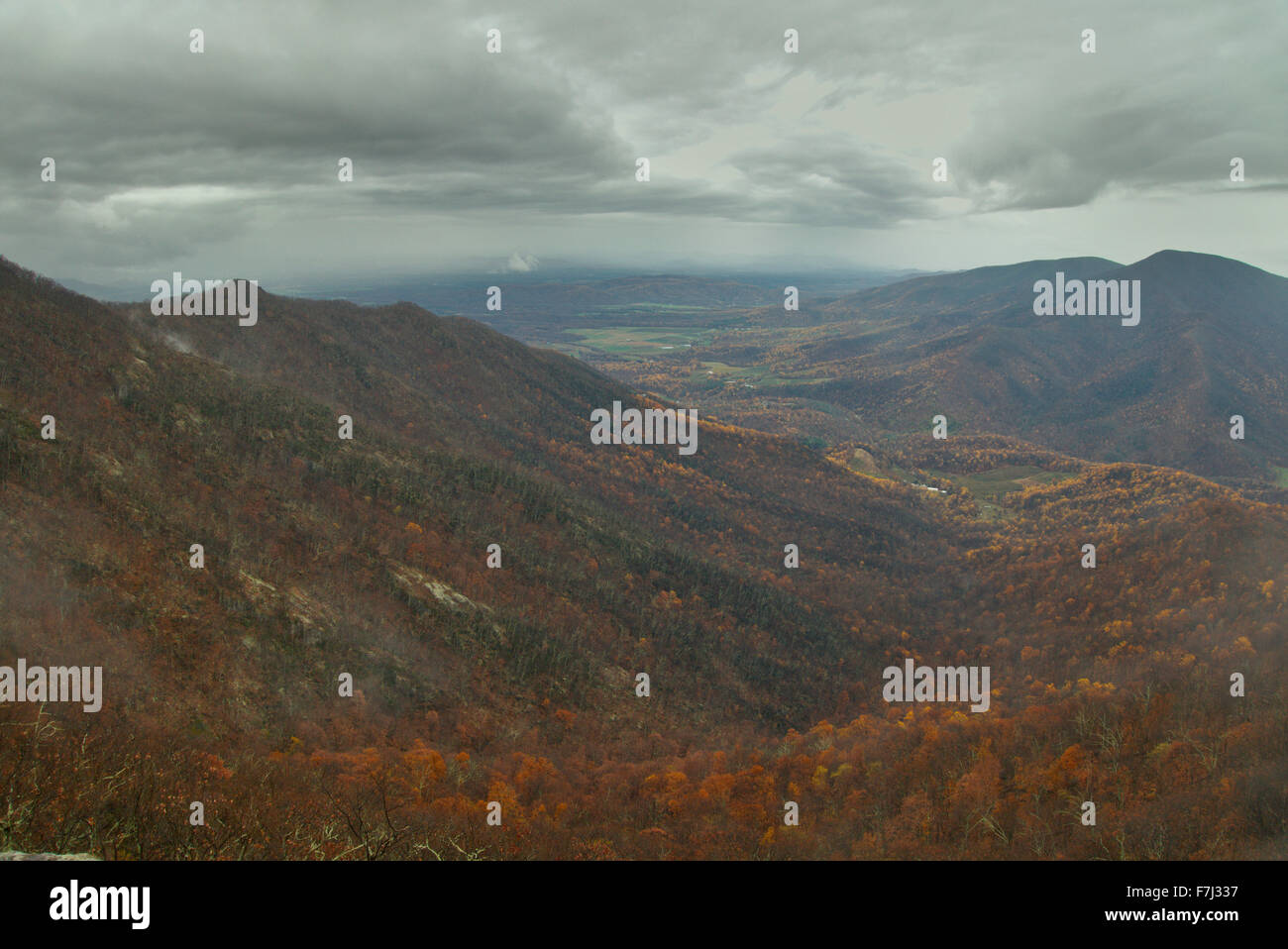 After an autumn storm, fog and clouds slowly lift above the Blue Ridge ...