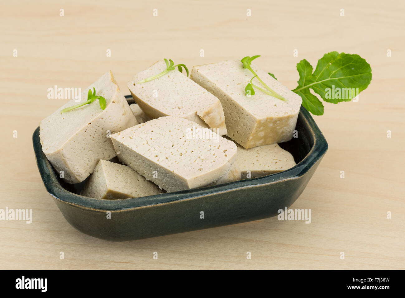 Tofu - soya cheese with herbs on the wood background Stock Photo - Alamy