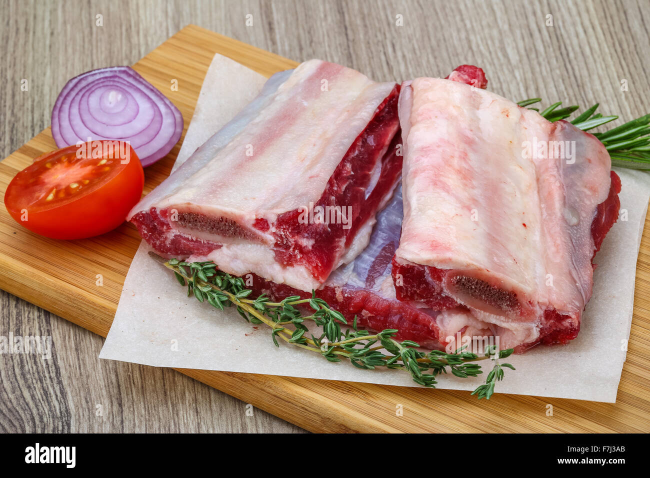 Raw beef ribs with rosemary and thyme - ready for cooking Stock Photo ...