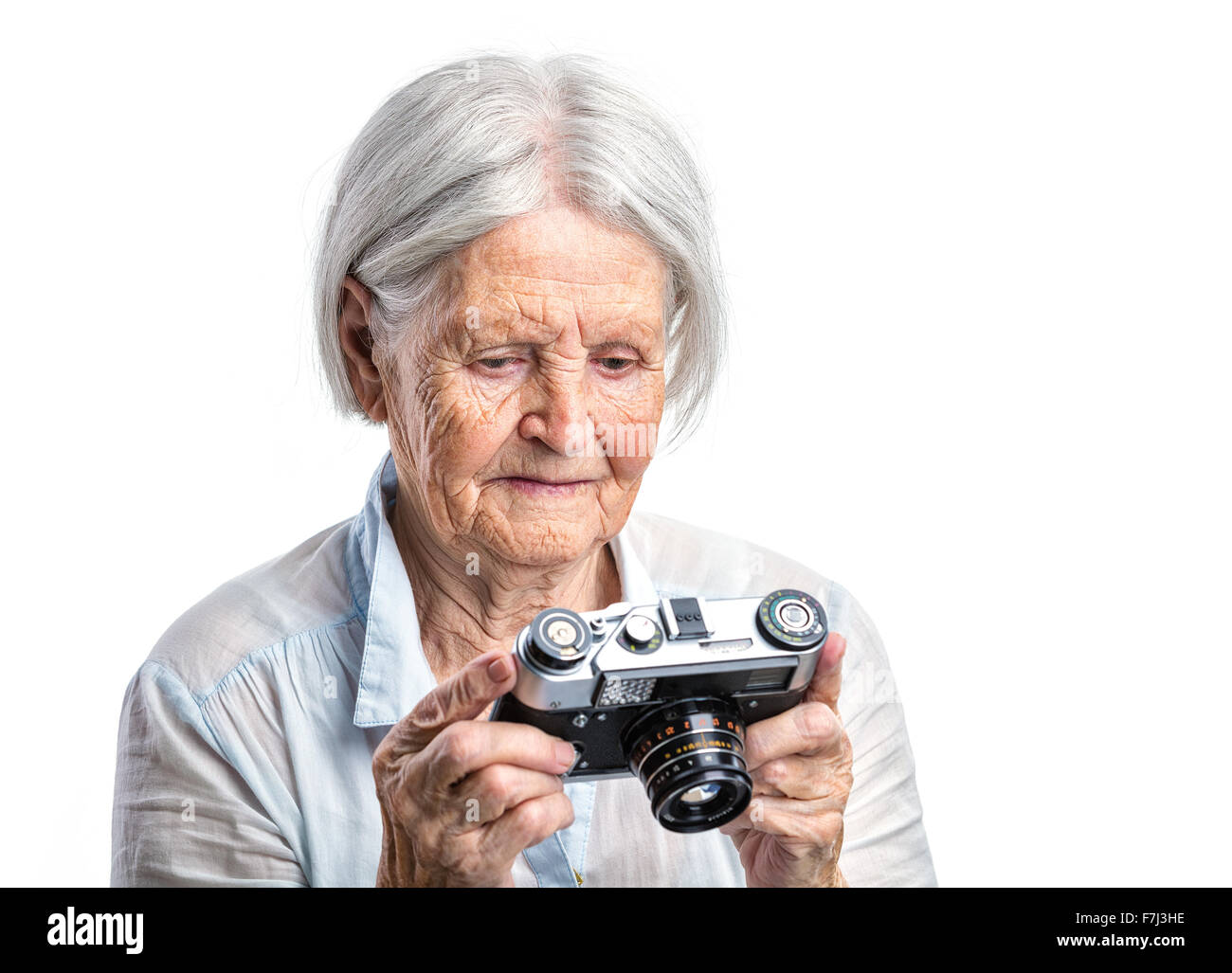 Senior woman with retro camera over white background Stock Photo - Alamy