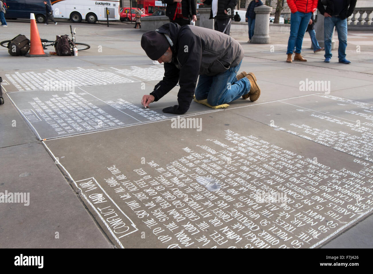 The Homeless Bard, a rough sleeping man writing poetry on the pavement ...