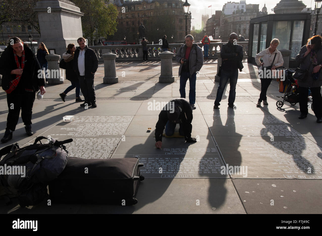 The Homeless Bard, a rough sleeping man writing poetry on the pavement ...