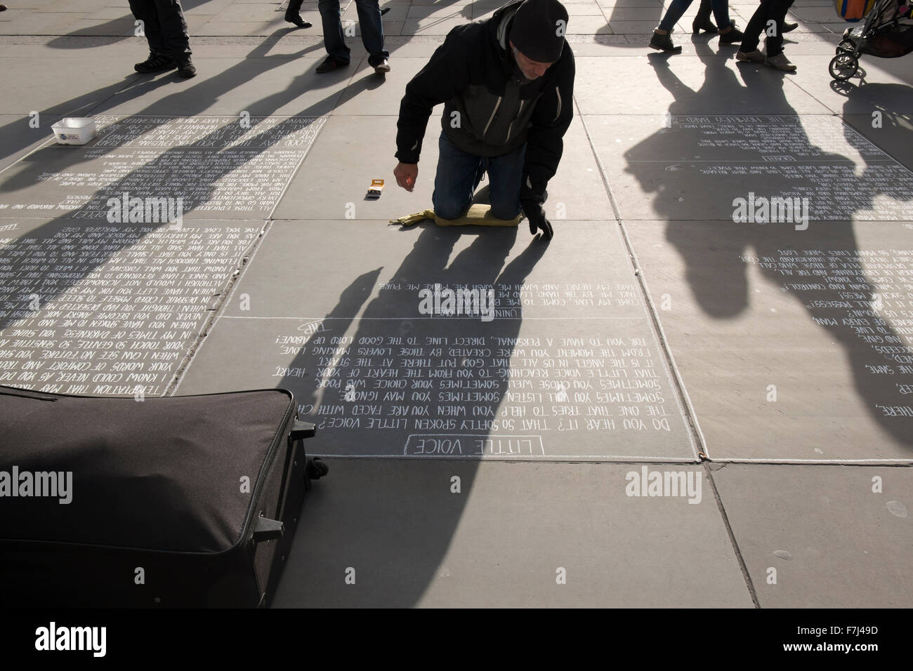 The Homeless Bard, a rough sleeping man writing poetry on the pavement ...