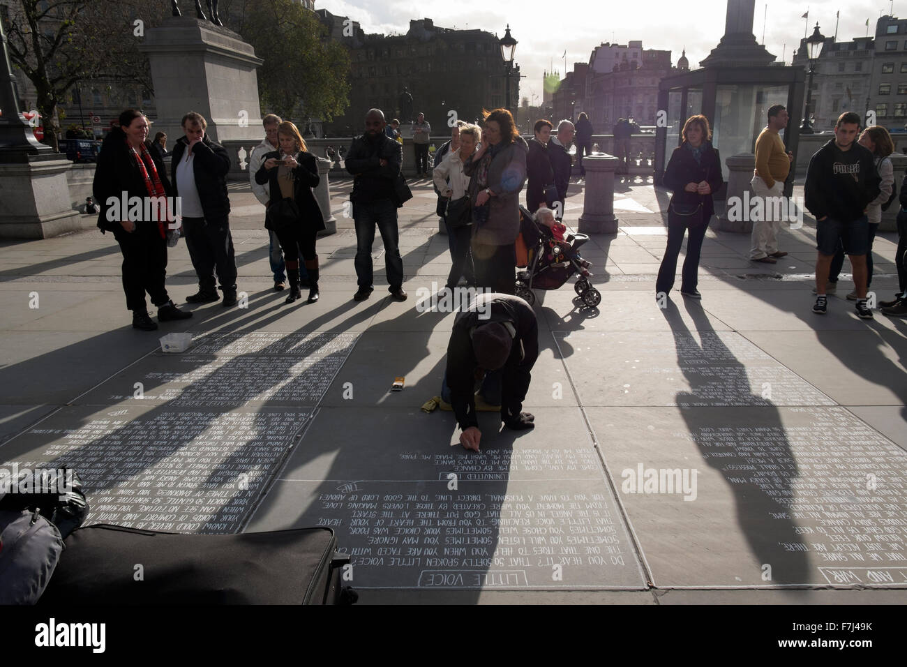 The Homeless Bard, a rough sleeping man writing poetry on the pavement ...
