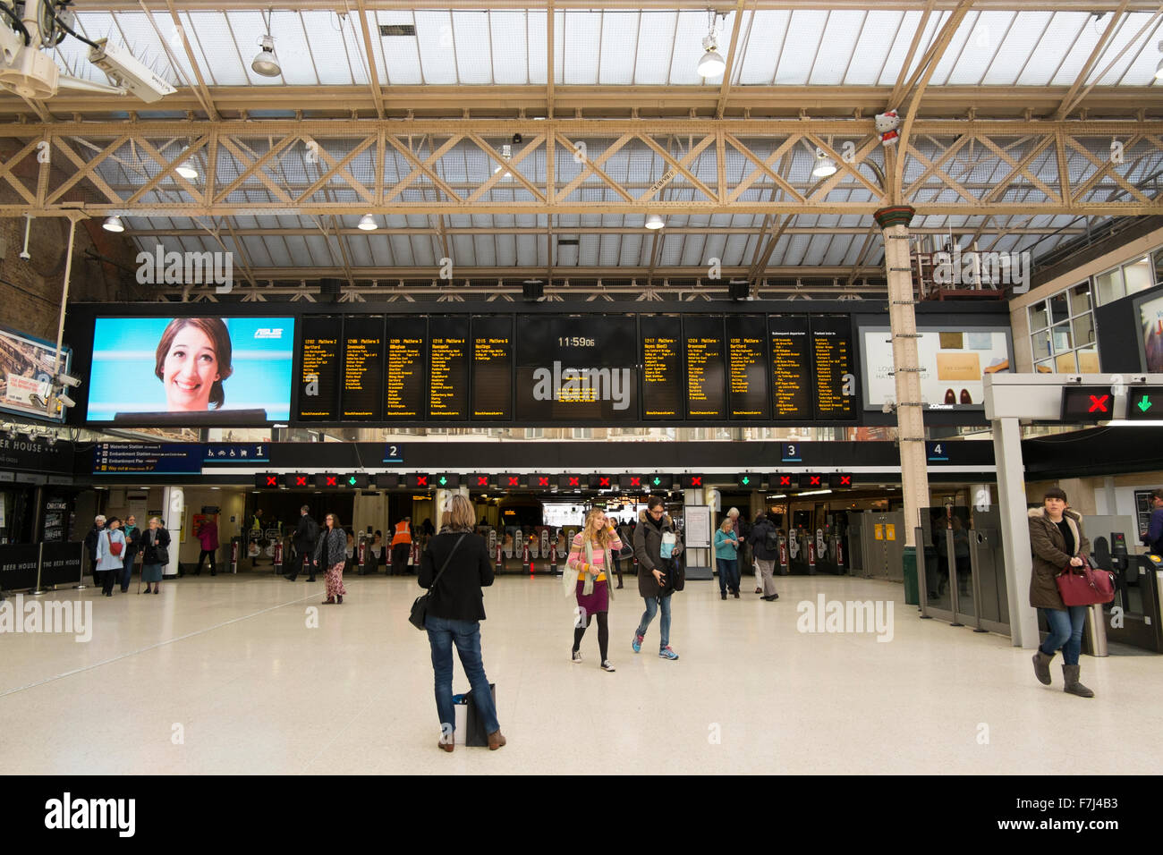 A woman standing on the concourse at Charing Cross railway station ...