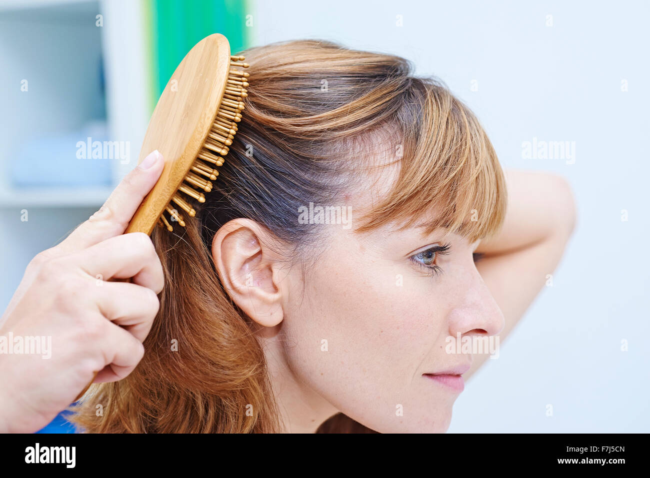 Mature woman brushing hair hi-res stock photography and images - Alamy
