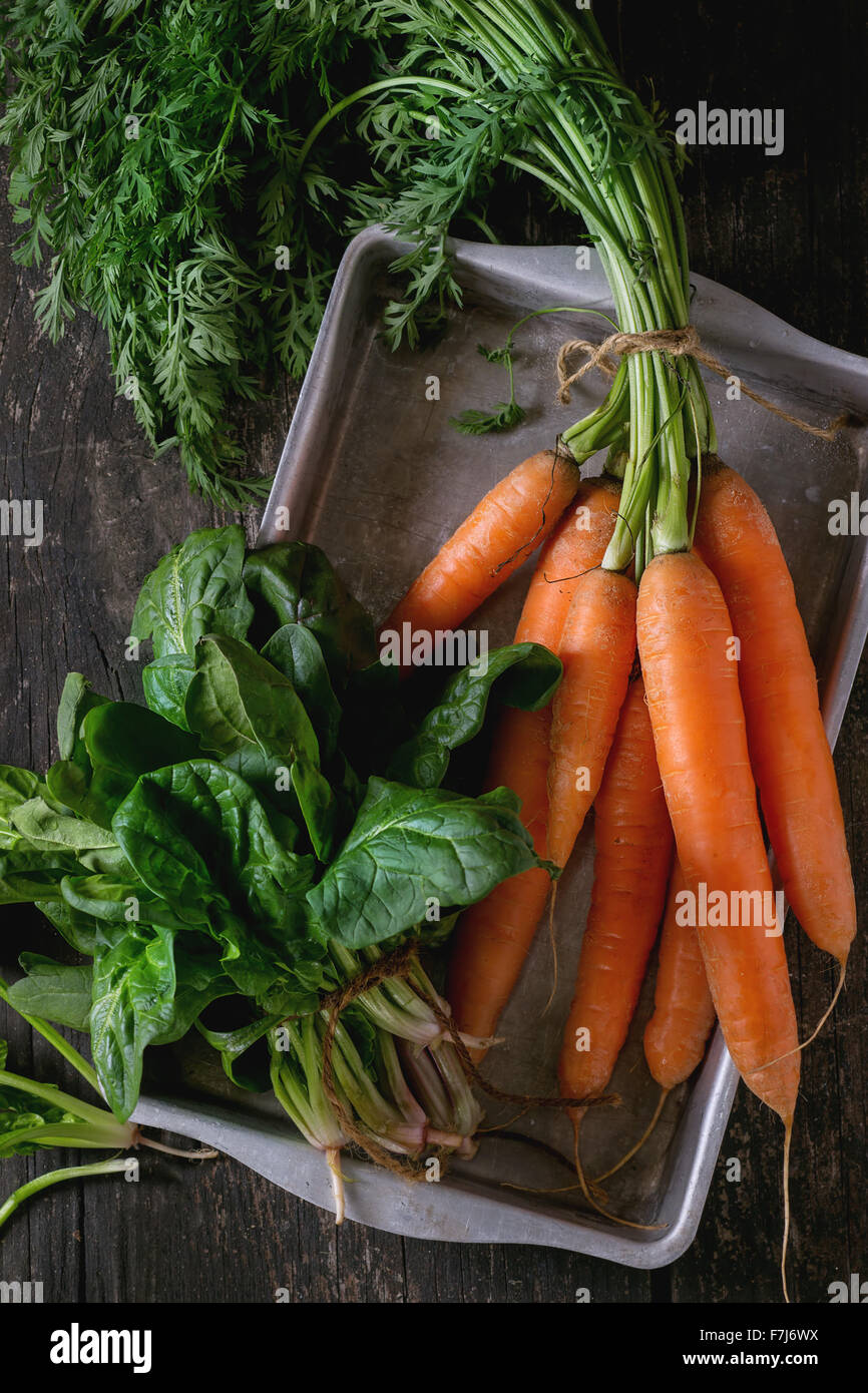 Bunch of carrot and spinach Stock Photo - Alamy