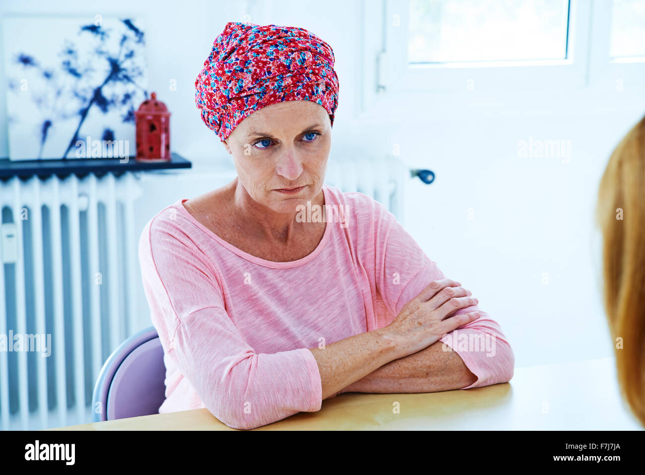 Doctor discussing cancer with elderly hi-res stock photography and ...