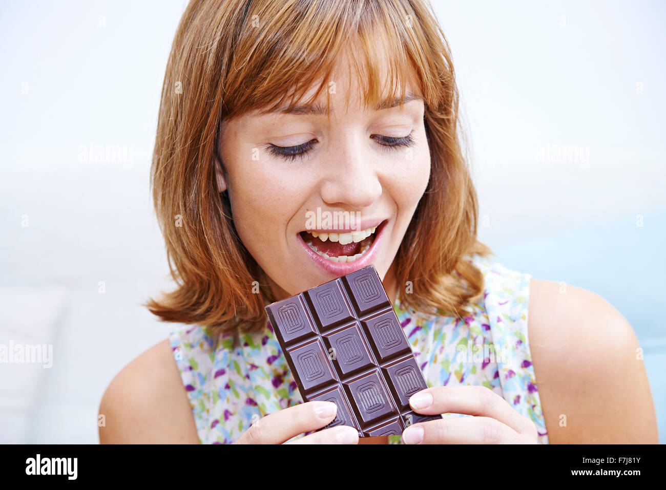 WOMAN EATING SWEETS Stock Photo - Alamy