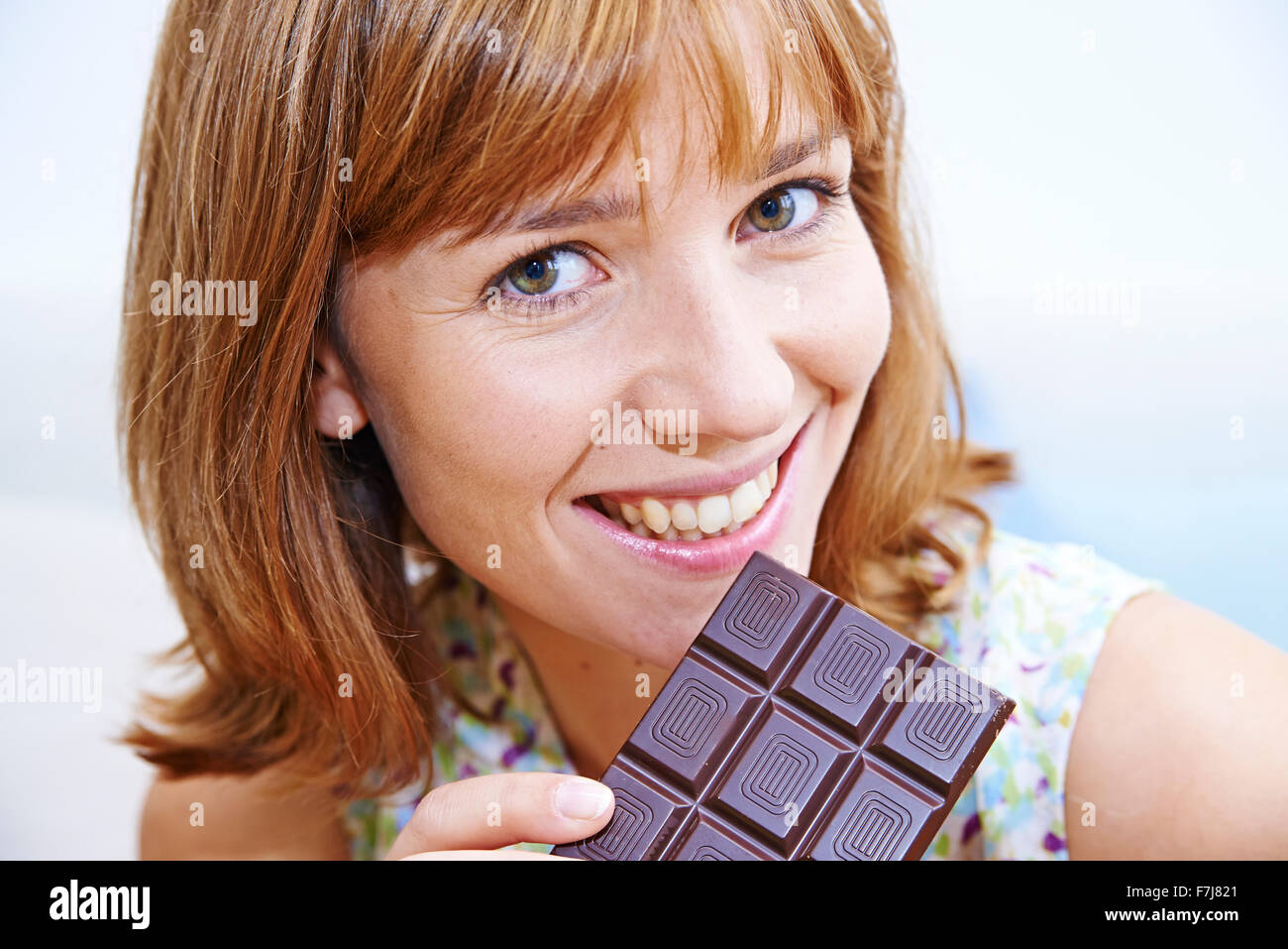 WOMAN EATING SWEETS Stock Photo - Alamy