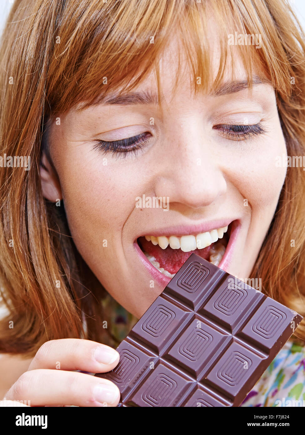 WOMAN EATING SWEETS Stock Photo - Alamy