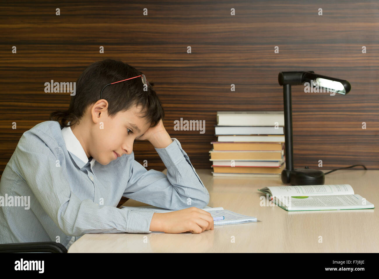Pupil elementary school does homework Stock Photo - Alamy