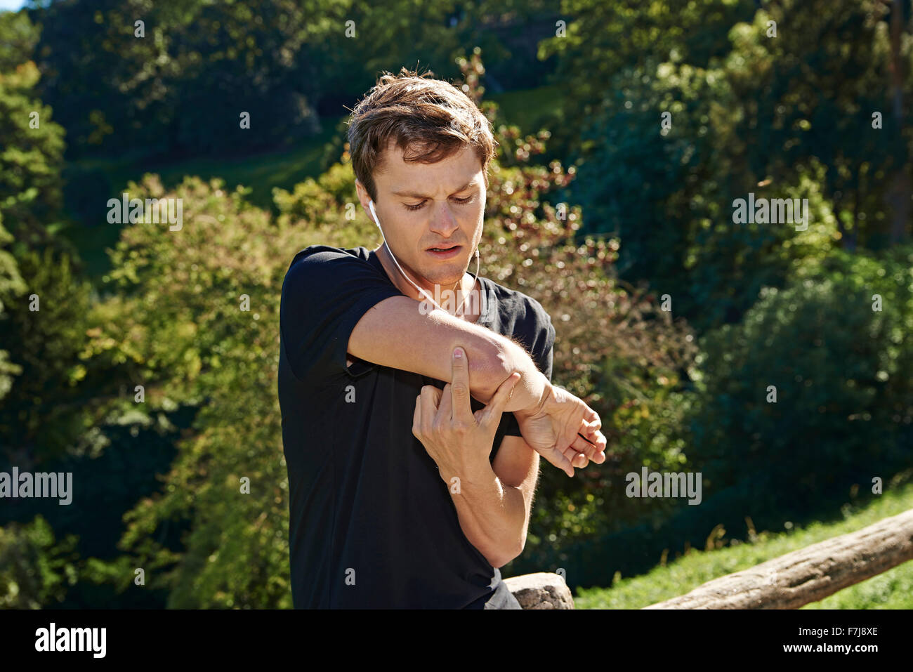 MAN WITH PAINFUL ELBOW Stock Photo - Alamy