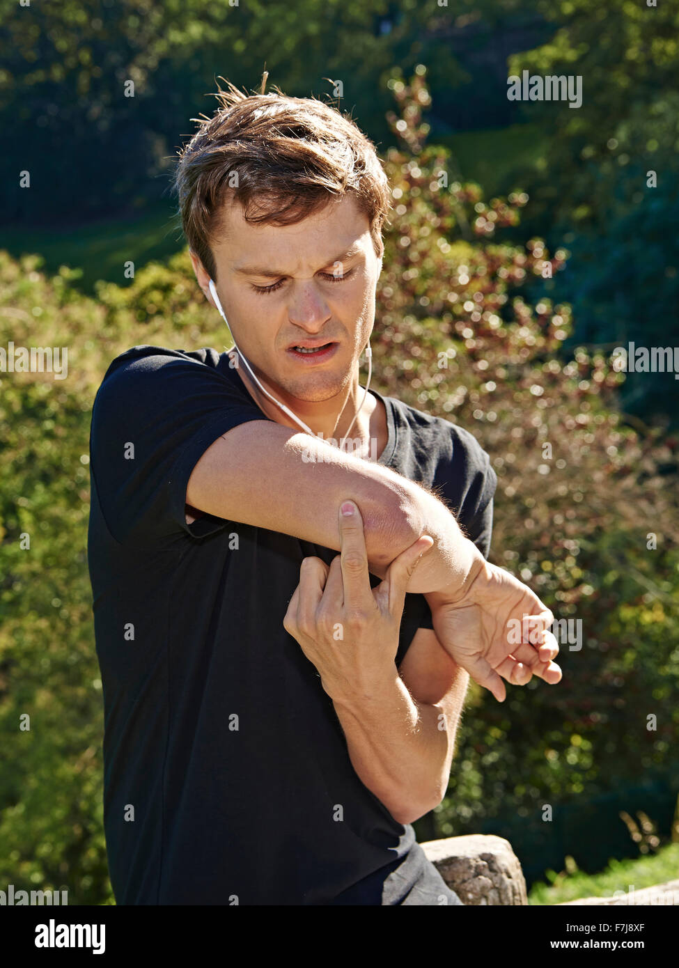 MAN WITH PAINFUL ELBOW Stock Photo - Alamy