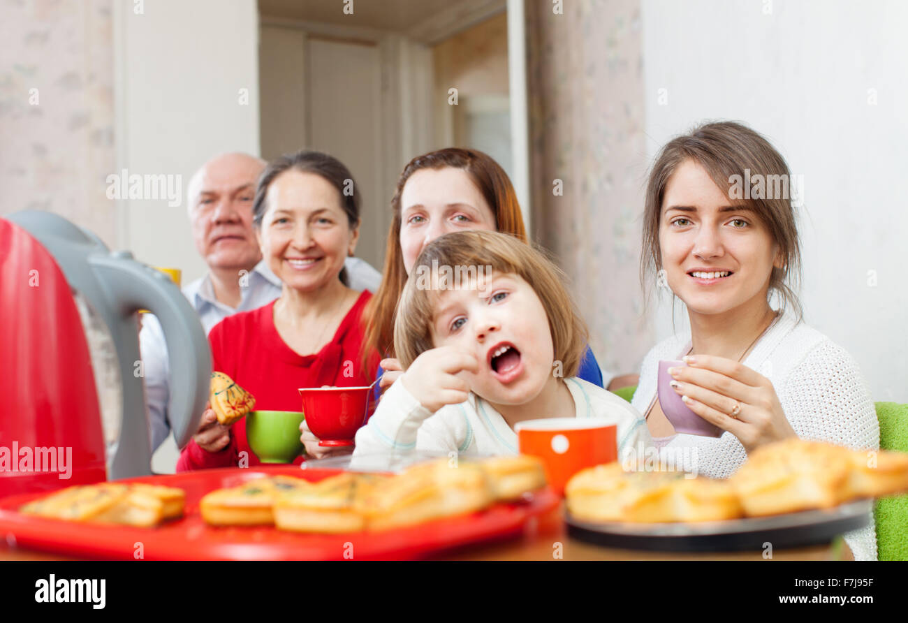 family having tea at home together Stock Photo - Alamy