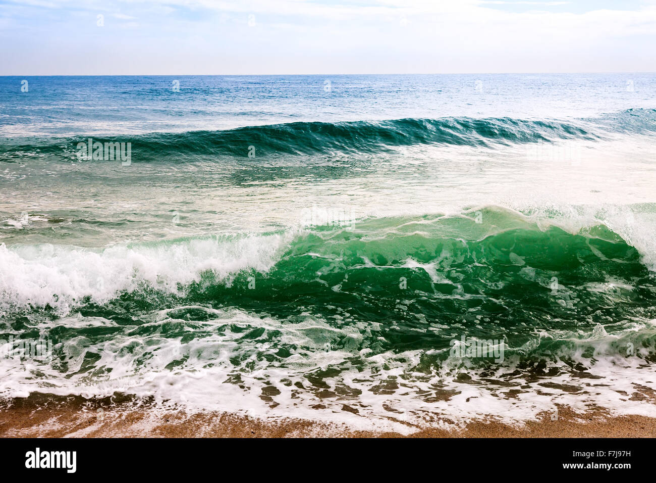 sea wave at sand beach in windy day Stock Photo - Alamy