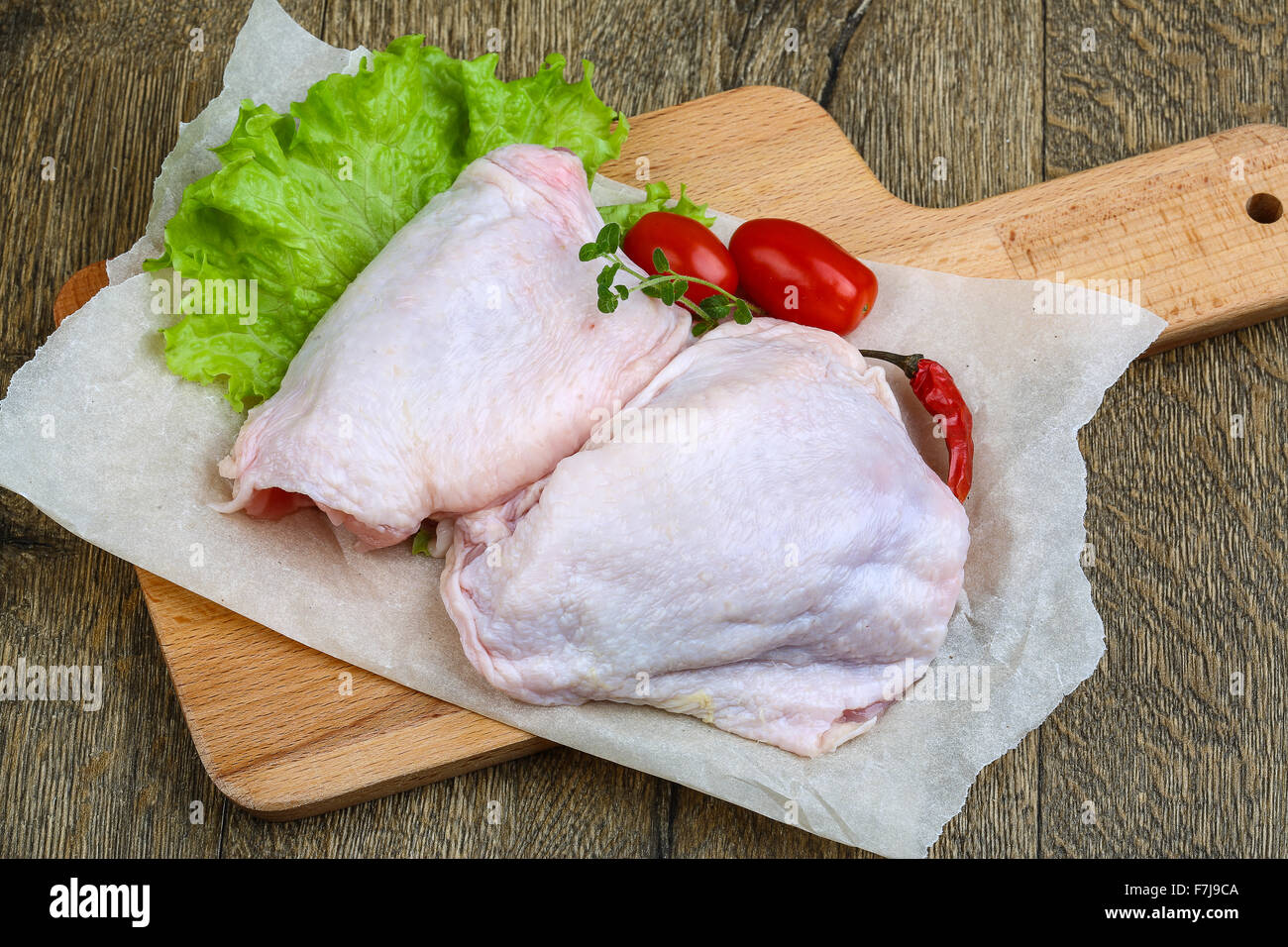 Raw chicken legs meat with herbs and spices ready for cooking Stock ...