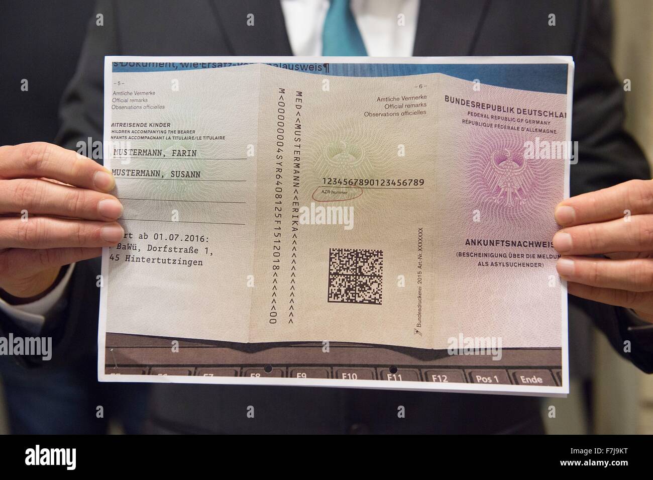 Dresden, Germany. 01st Dec, 2015. A man holds up a photograph of an ...