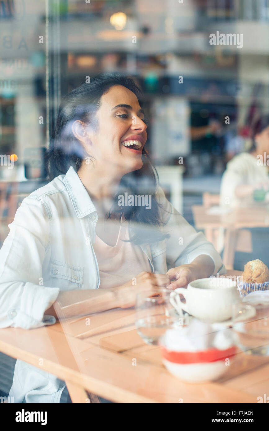 Woman in coffee shop Stock Photo - Alamy