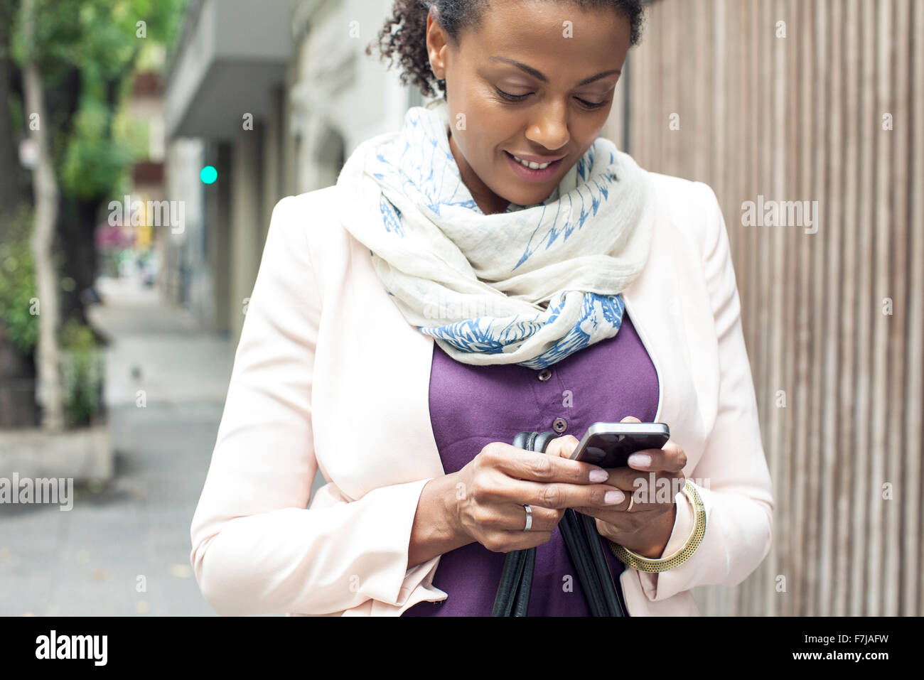Woman using cell phone Stock Photo - Alamy