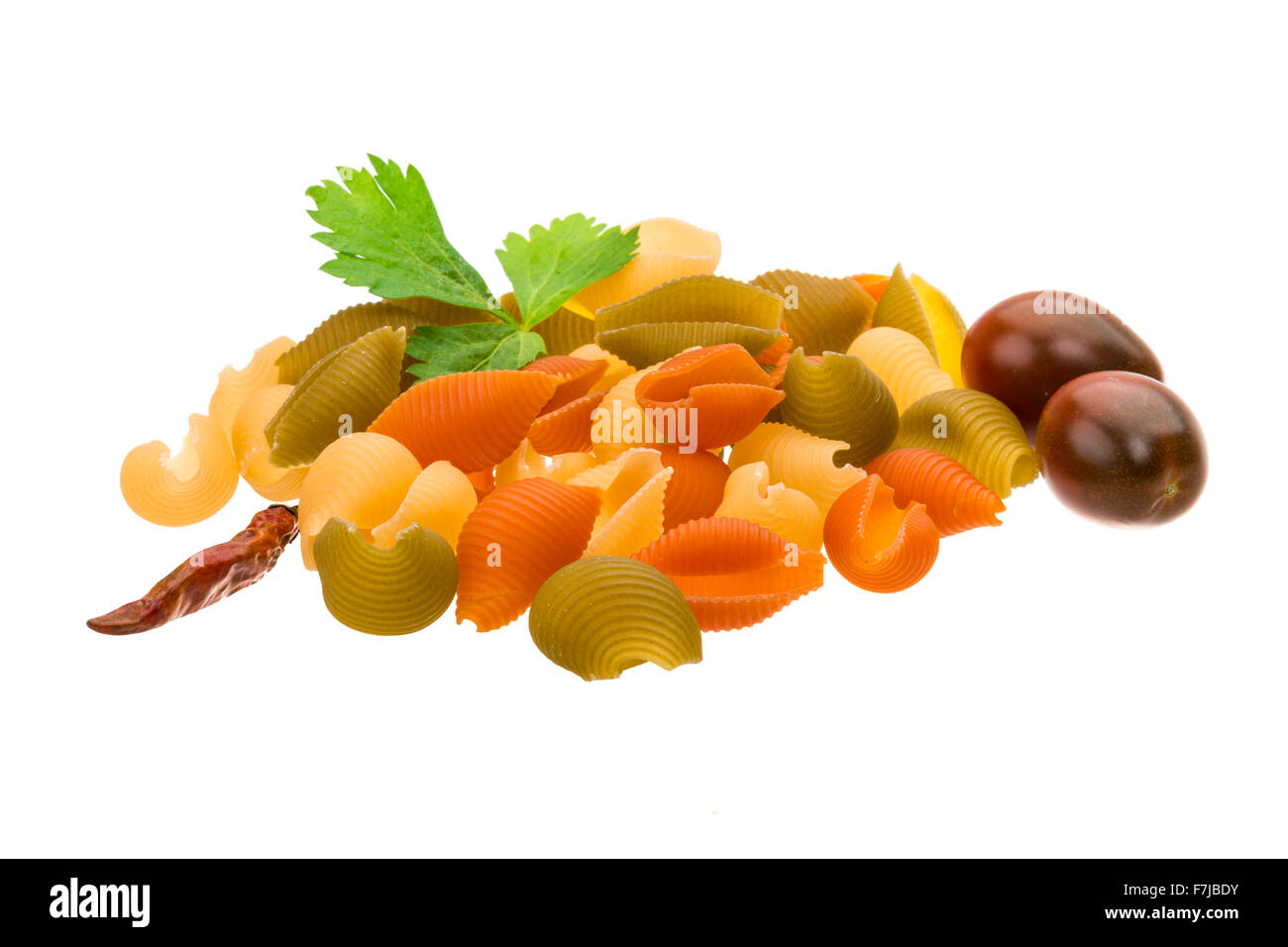 Macaroni - various color with herbs and tomato Stock Photo - Alamy