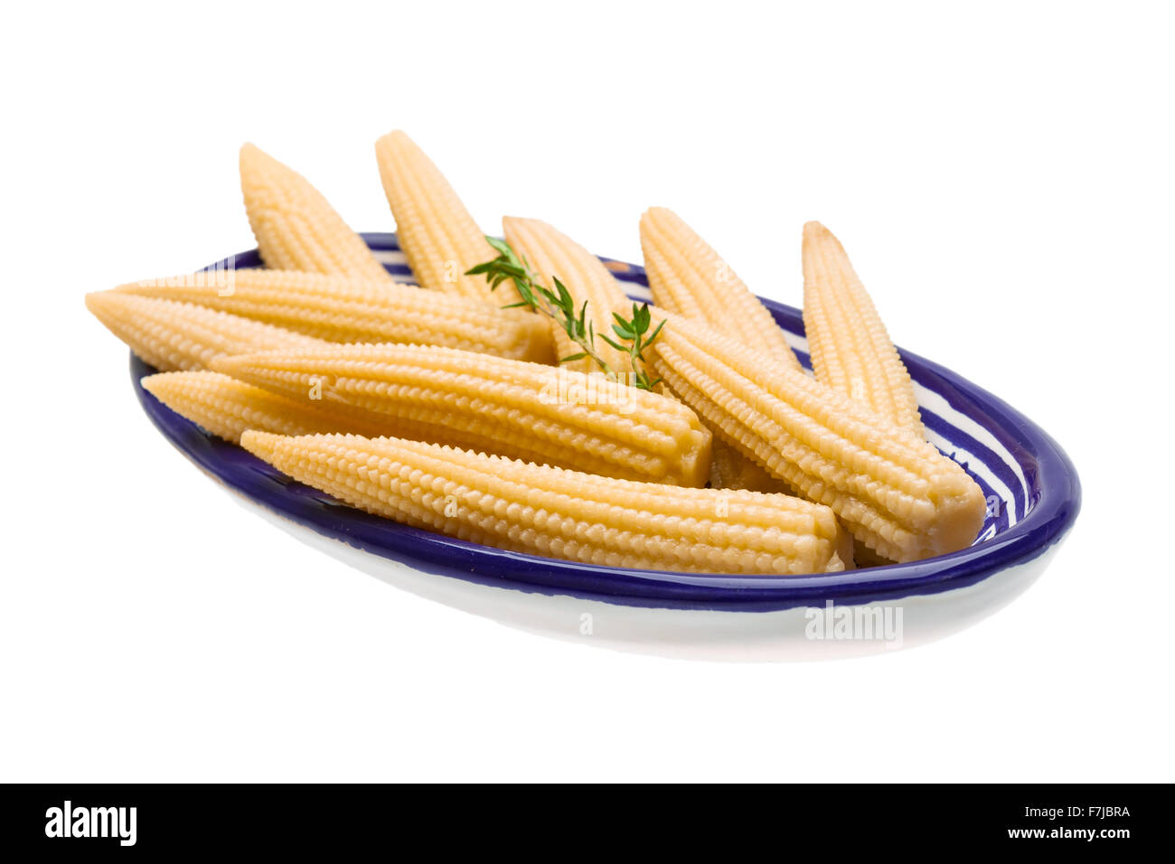 Baby corn with thyme Stock Photo - Alamy