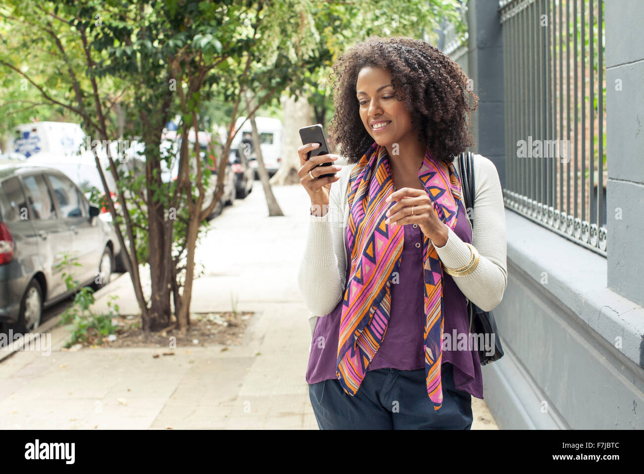 Woman using cell phone Stock Photo - Alamy