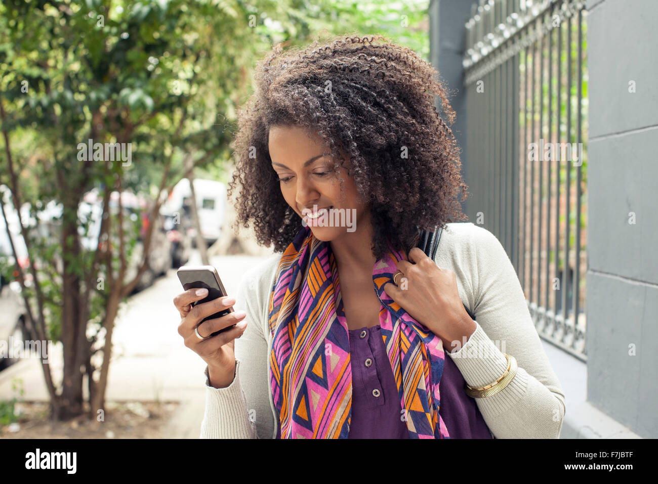 Woman using cell phone Stock Photo - Alamy