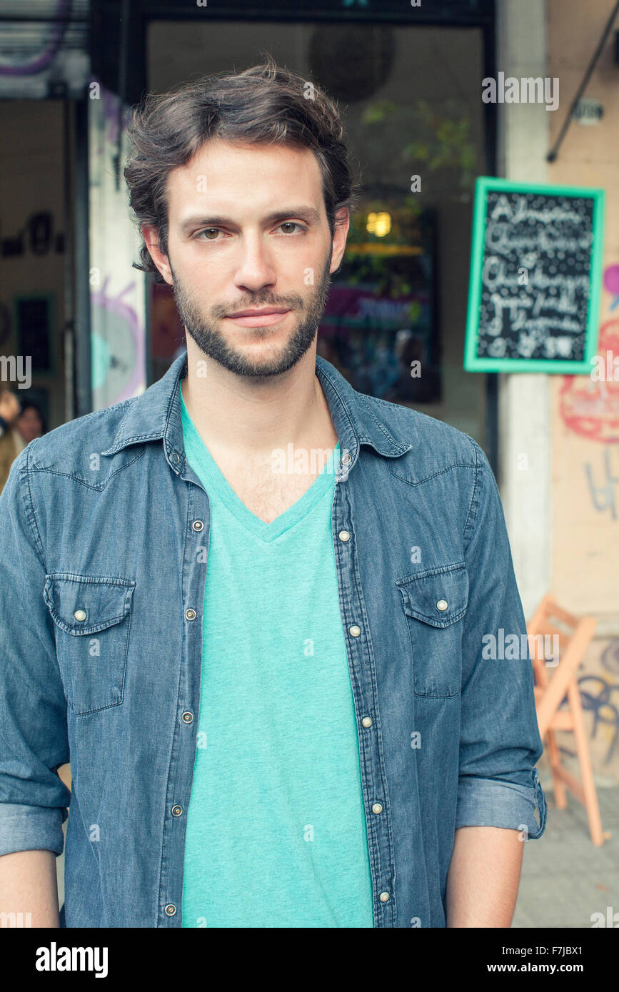 Man standing outside of cafe, portrait Stock Photo - Alamy