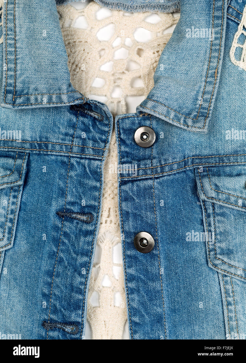 Close-up of blue denim jacket with lace Stock Photo - Alamy