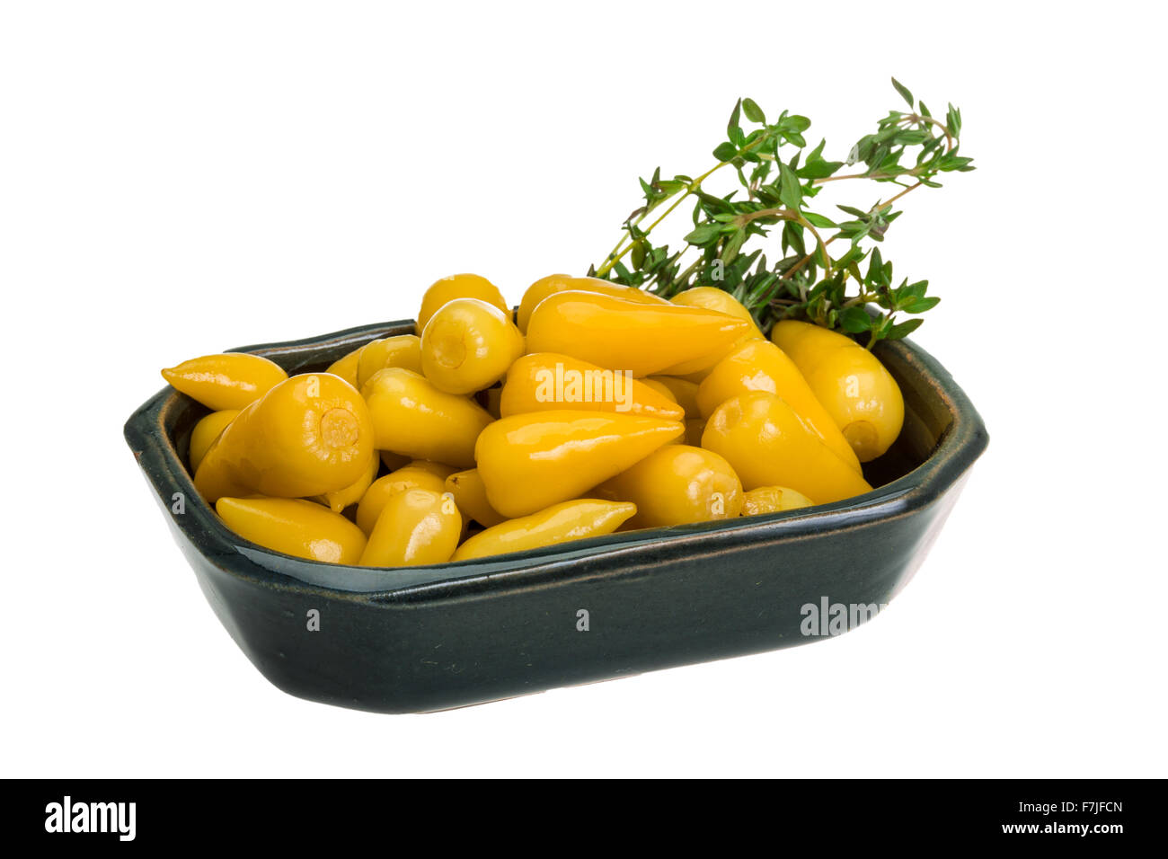 Yellow marinated pepper with thyme Stock Photo - Alamy