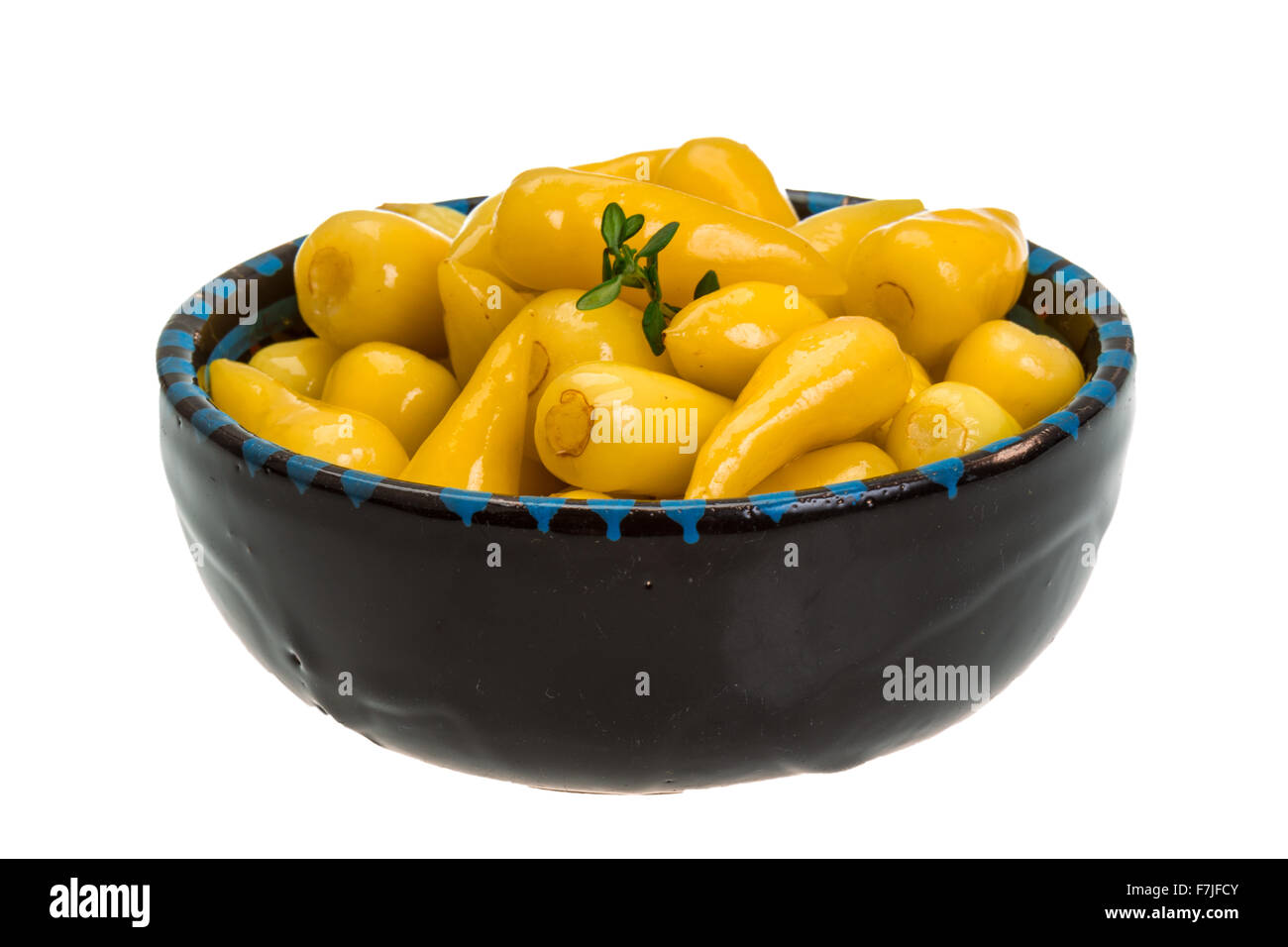 Yellow marinated pepper with thyme Stock Photo - Alamy