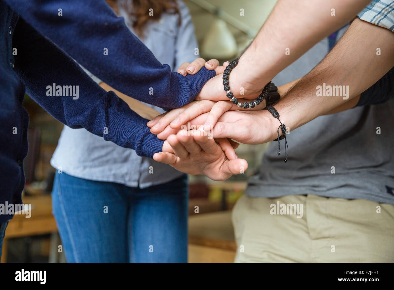 Team work concept. People put their hands together at the meeting Stock ...