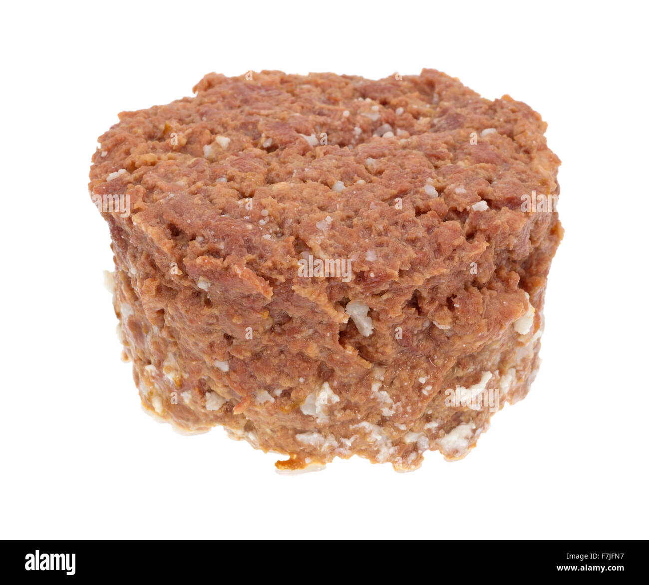 A large chunk of canned corned beef isolated on a white background ...