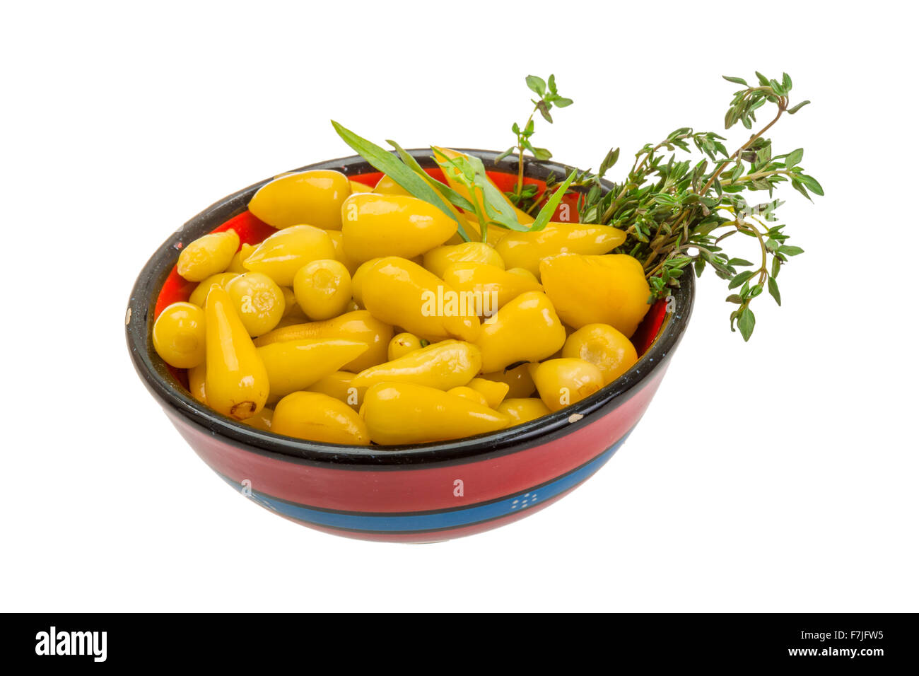 Yellow marinated pepper with thyme Stock Photo - Alamy