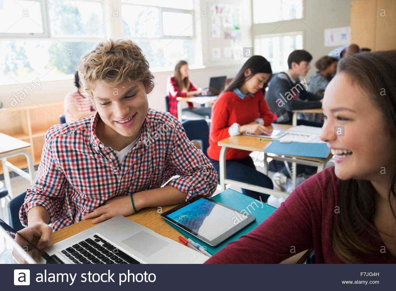 High school students using laptop in classroom Stock Photo - Alamy