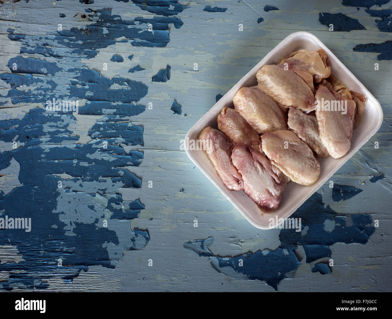 Nov. 25, 2015 - Raw chicken wings on old weathering painted table ...