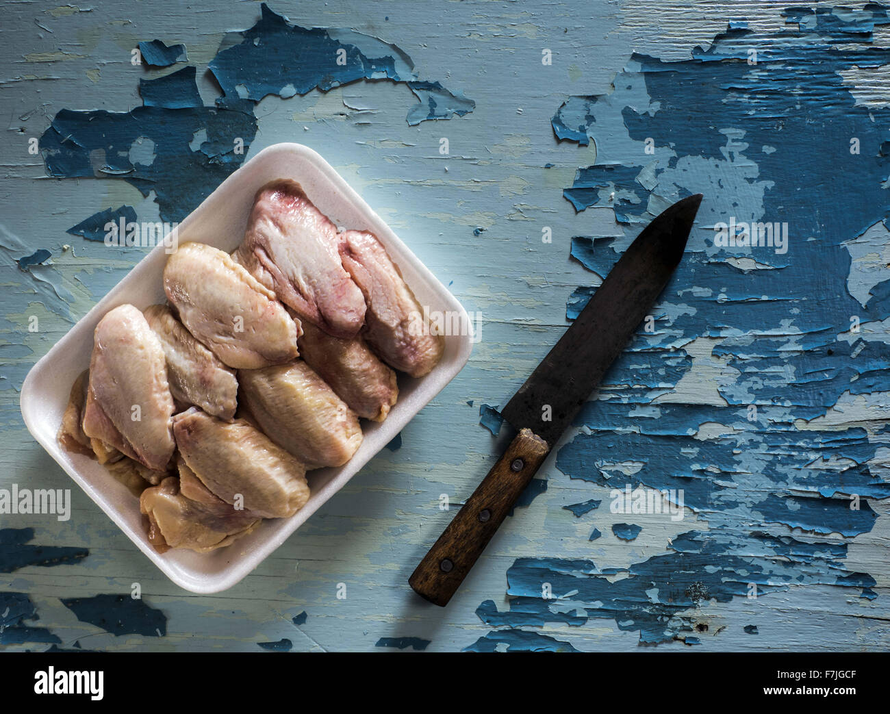 Nov. 25, 2015 - Raw chicken wings on old weathering painted table ...