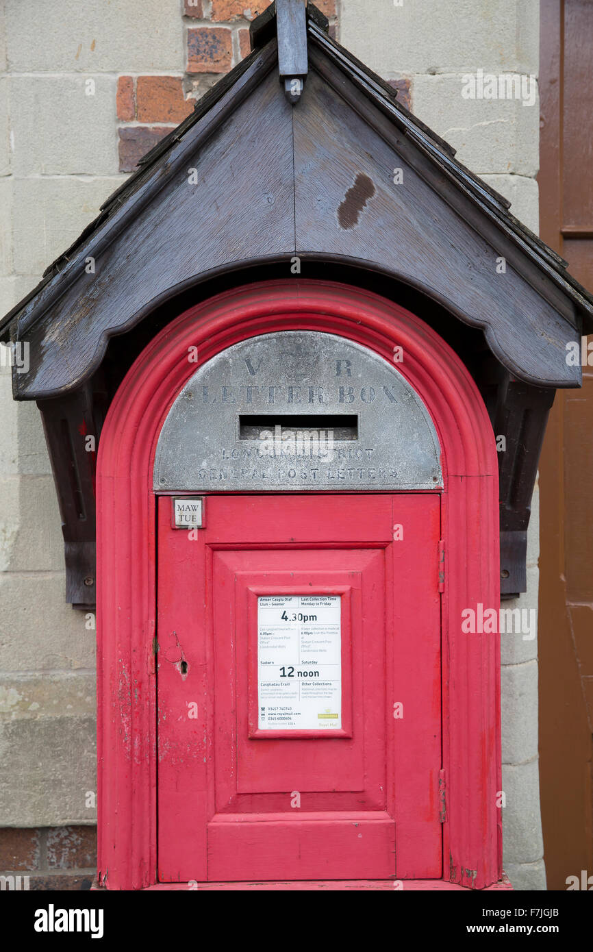 An old King George wooden red post box at Llandridnod wells in Wales ...