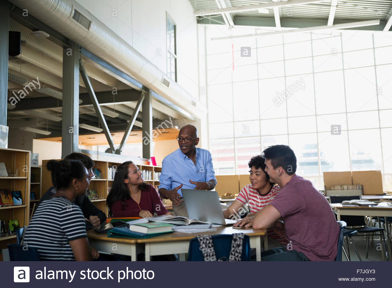 Listening to teacher hi-res stock photography and images - Alamy