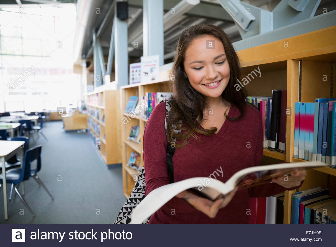 Smiling teenager book hi-res stock photography and images - Alamy