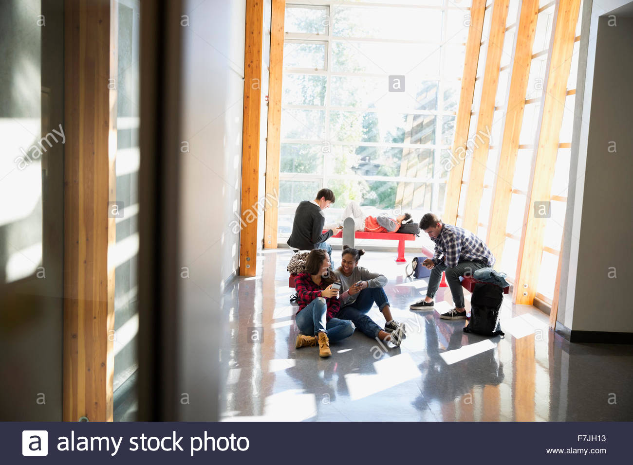High school students hanging out in lounge Stock Photo - Alamy