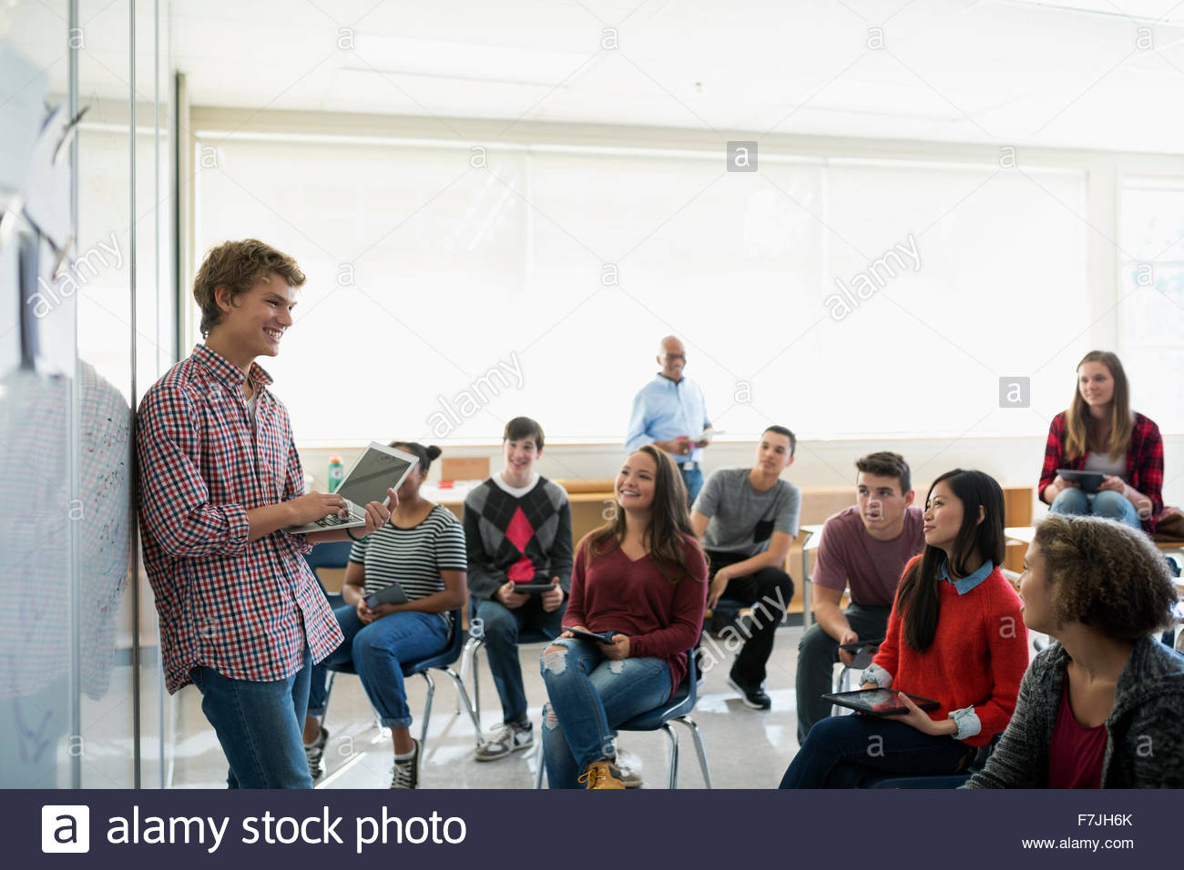 High school student giving presentation in classroom Stock Photo ...