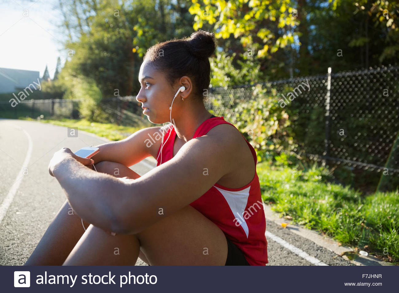 Teenage girl sitting race track hi-res stock photography and images - Alamy